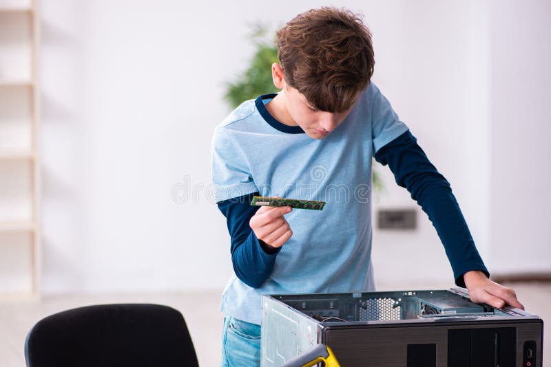 Boy Reparing Computers at Workshop Stock Photo - Image of motherboard ...