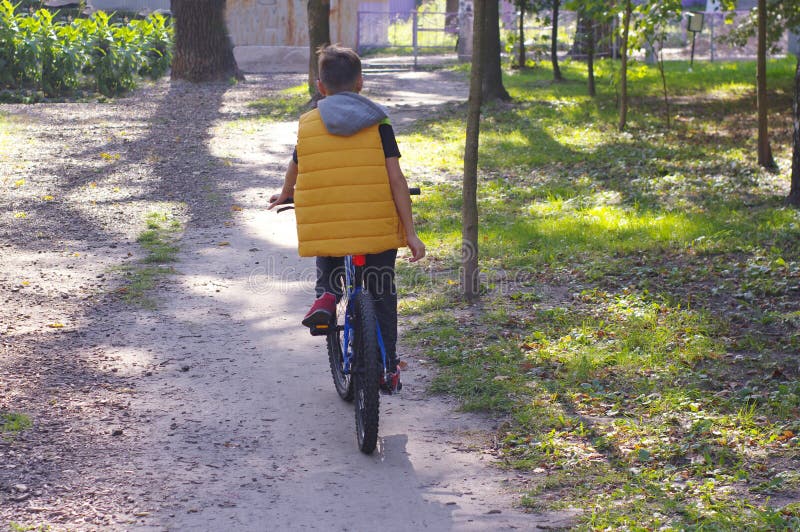 Teenager Riding a Bicycle in the Sun Stock Image - Image of summer ...