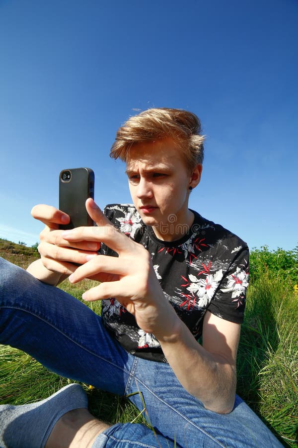 Teenager with smartphone stock image. Image of blue, wireless - 43317651