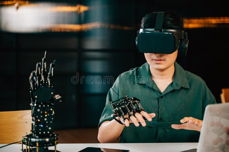 Asian Teenager Experiments Robot Arm Project Using Vr Glasses Stock ...