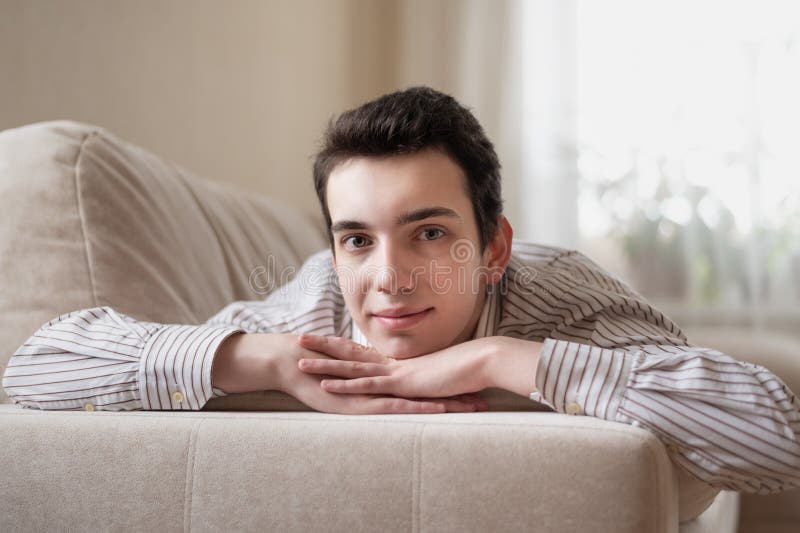 Teenager Young Man Lying on Sofa at Home Stock Photo - Image of ... Teenager Young Man Lying on Sofa at Home Stock Photo - Image of ...