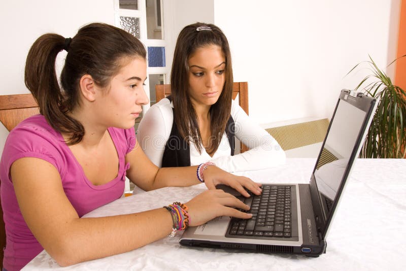 Teenagers with computer stock photo. Image of girls, concentration ...