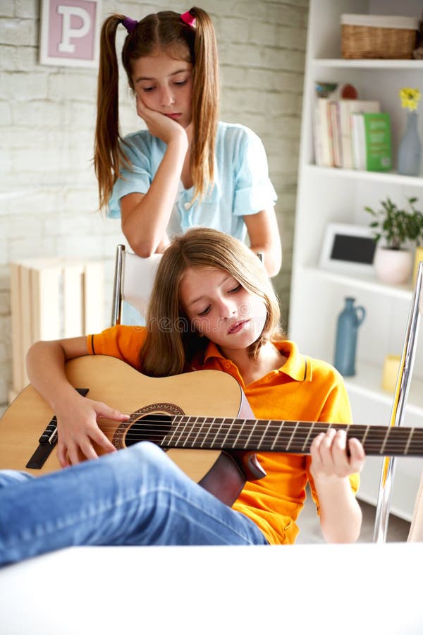 Teenagers Learn To Play Guitar Stock Image - Image of instrument ...