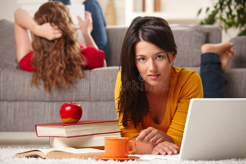 Teenagers learning at home stock image. Image of friends - 25641997
