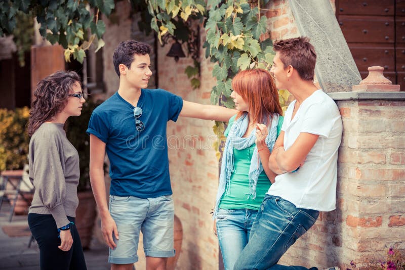 Teenagers talking outdoor stock photo. Image of meeting - 24701754