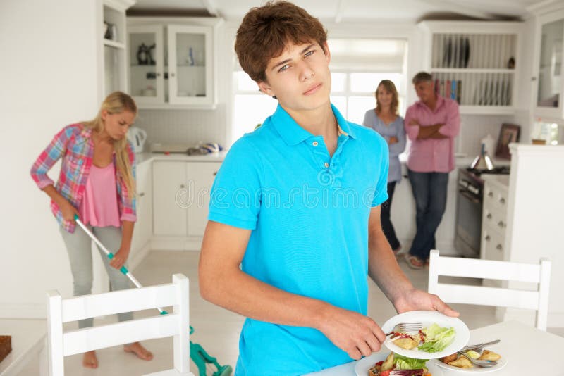 Teenagers Reluctantly Doing Housework Stock Photo - Image of horizontal ...