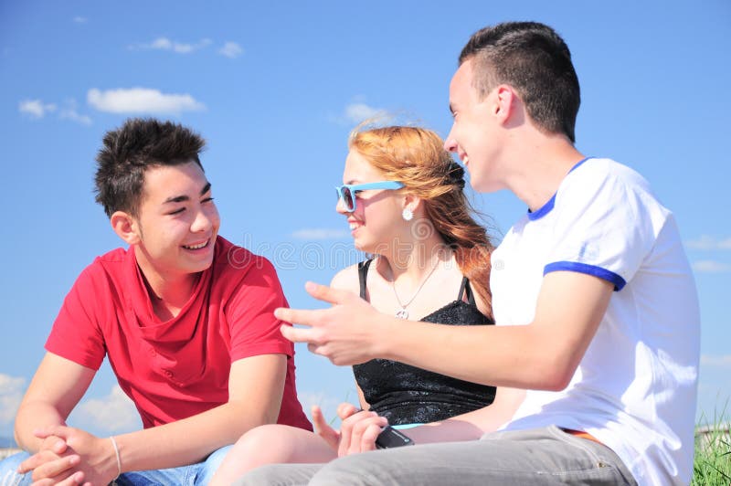 Teenagers talking outdoor stock photo. Image of meeting - 24701754