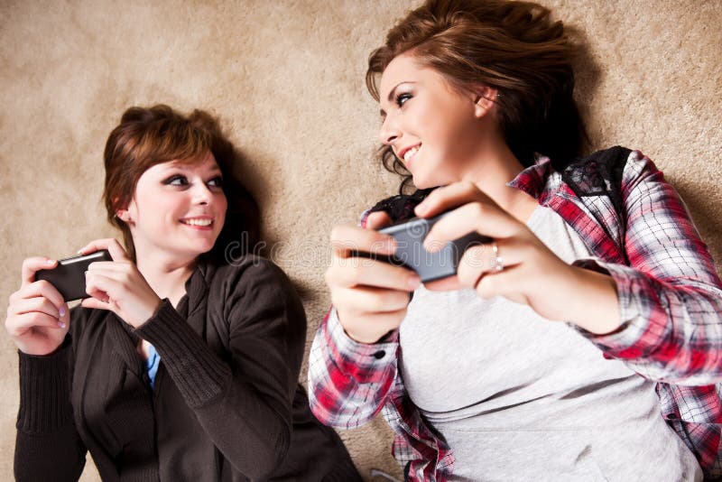 Teenagers texting stock photo. Image of women, beautiful - 18317892