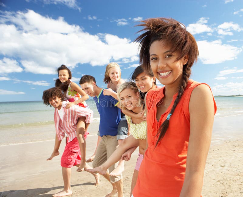 Teenagers walking on beach stock photo. Image of lifestyle - 21402130