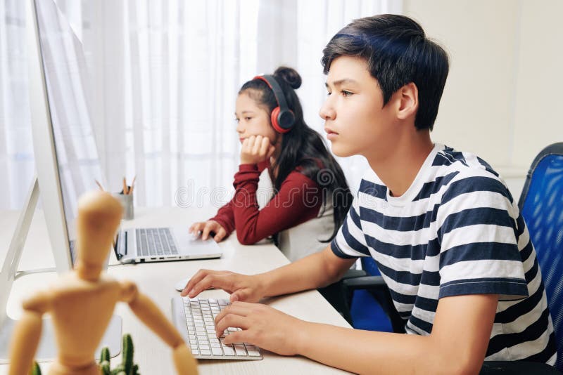 Teenagers Working on Computers Stock Photo - Image of smiling, laptop ...