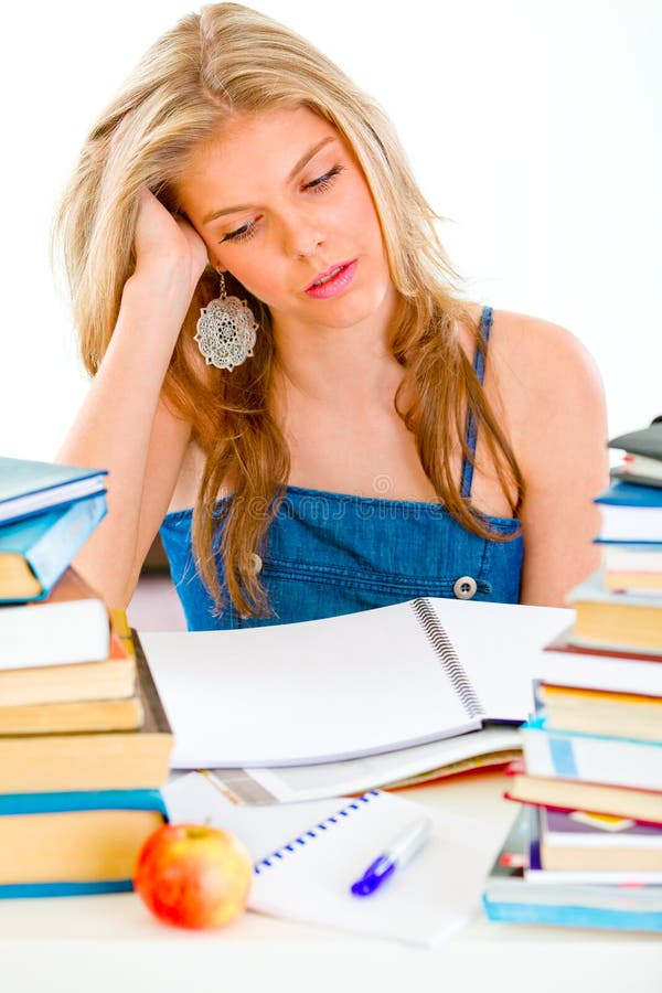 Teengirl Sitting at Table and Thinking on Homework Stock Photo - Image ...