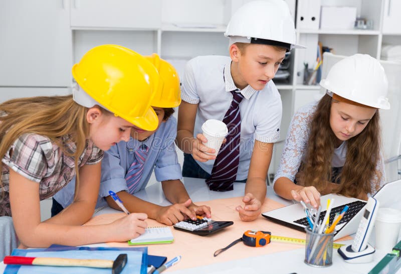 Teens Engineers Discussing Draft at the Table Stock Photo - Image of ...