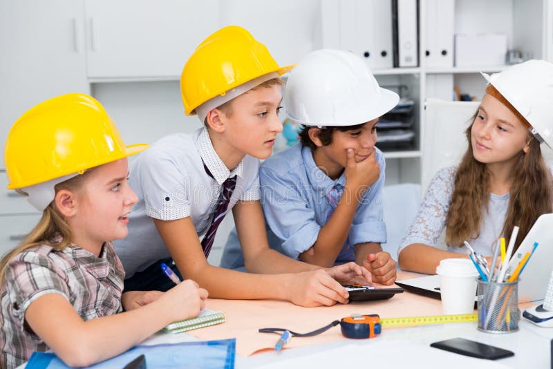 Teens Engineers Discussing Draft at the Table Stock Image - Image of ...