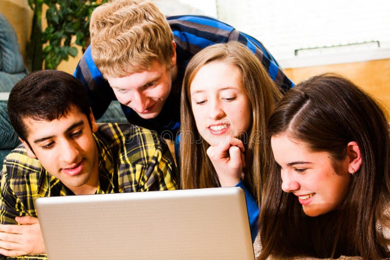 Teens Crowd Around Computer Stock Image - Image of computer, horizontal ...