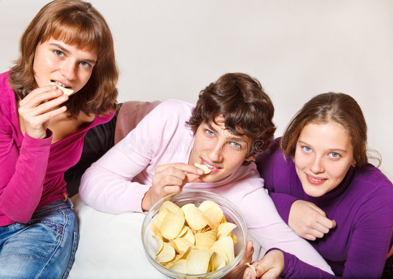 Teens eating stock photo. Image of junk, kids, outdoor - 16378680