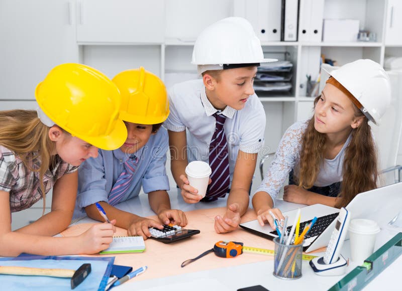 Teens Engineers Discussing Draft at the Table Stock Image - Image of ...