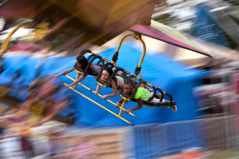 Teens on a Flying Carnival Ride Motion Blur Editorial Stock Photo ...
