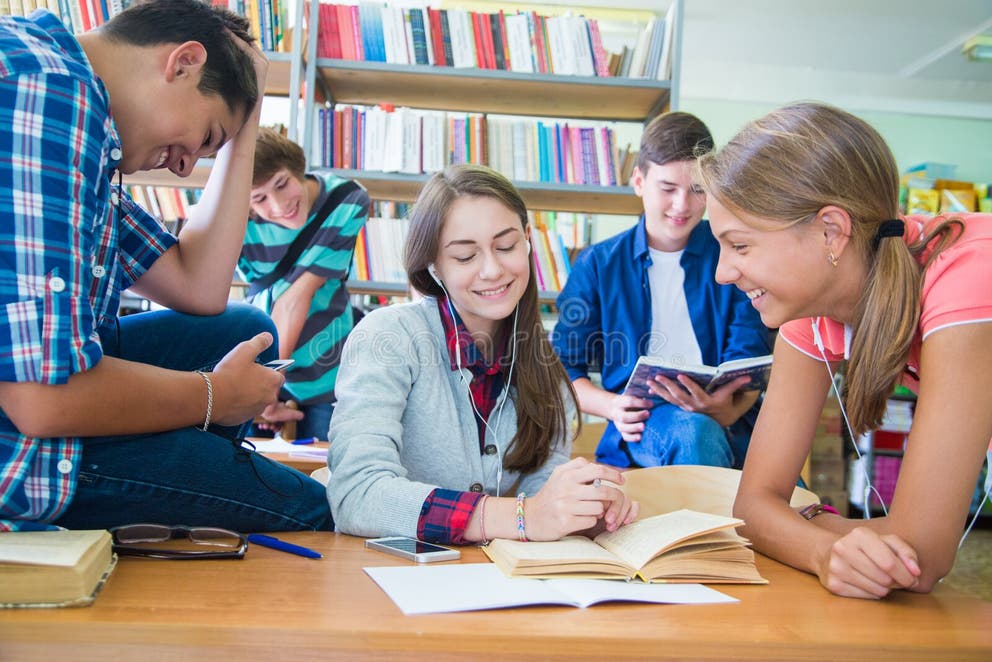 Teens in library stock photo. Image of adolescence, males - 66340616