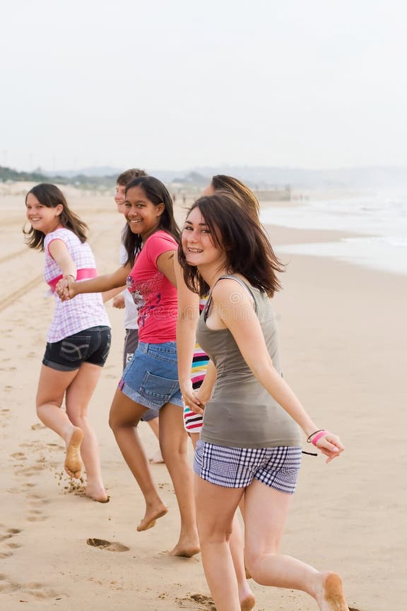 Teens running stock image. Image of holding, active, cheerful - 10971133