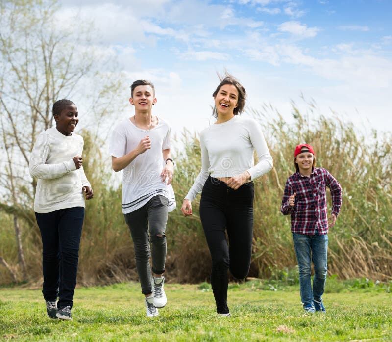 Teens Running in Spring Park Stock Image - Image of boys, people: 76458597