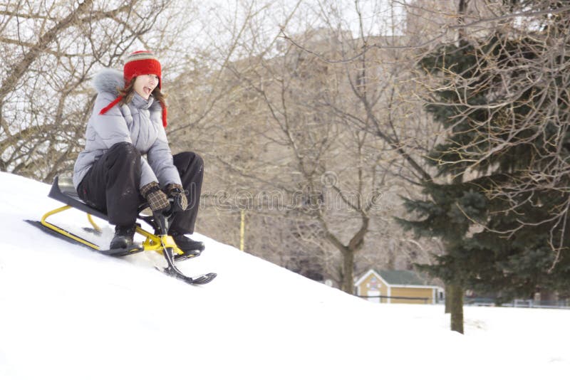 Teens sliding in winter stock photo. Image of playful - 18810396