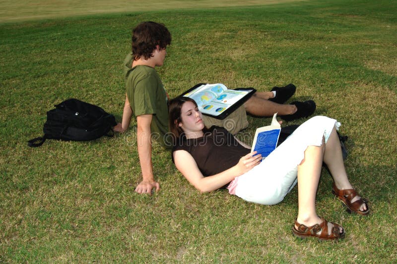 Teens studying outdoors stock image. Image of park, backpack - 2928099