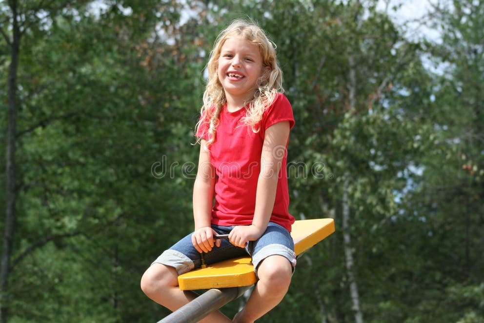 Teeter totter girl stock photo. Image of cute, play, affectionate - 3059742
