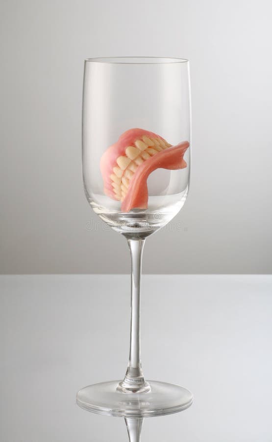 Teeth on Wine glass stock image. Image of dentures, biting - 4249411