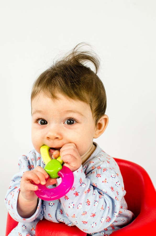 Teething baby girl stock image. Image of soothing, cute - 76370803