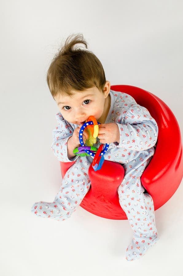Teething baby girl stock image. Image of colorful, ache - 76370895