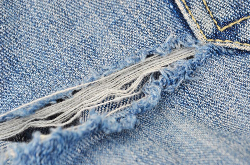 Tela rasgada tejanos foto de archivo. Imagen de imagen - 33160938