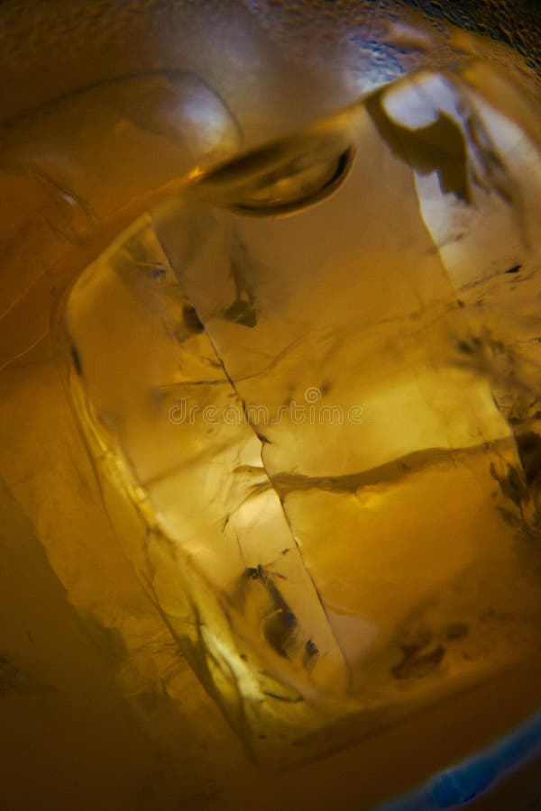 Teksture of Ice Cubes on the Background of Deep Orange Light Stock ...
