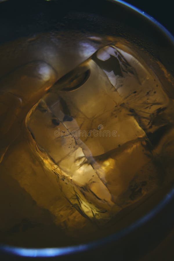 Teksture of Ice Cubes on the Background of Deep Orange Light Stock ...