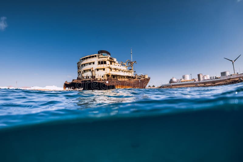 Telamon Wreck Ship in Blue Ocean. Split View Stock Image - Image of ...