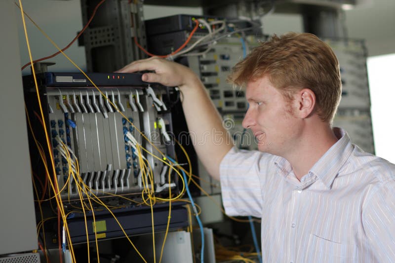 Telecom Engineer Looks on Multiplexer Stock Image - Image of optical ...