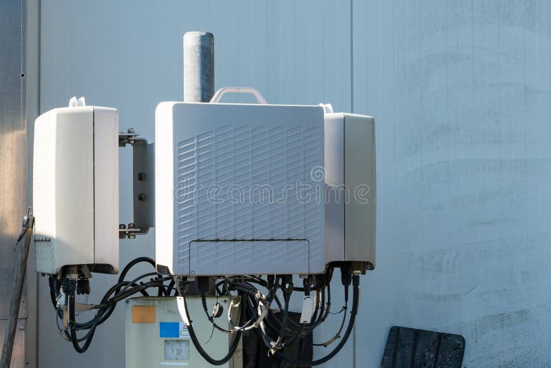 Telecommunication Equipment Mounted on a Black Wall at an Industrial ...