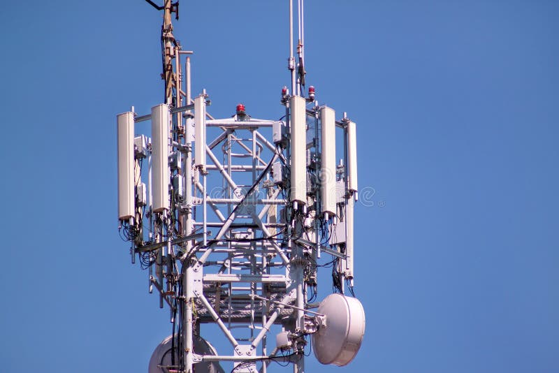 Transmitter and Repeater Signal in the Woods Against the Blue Sky and ...