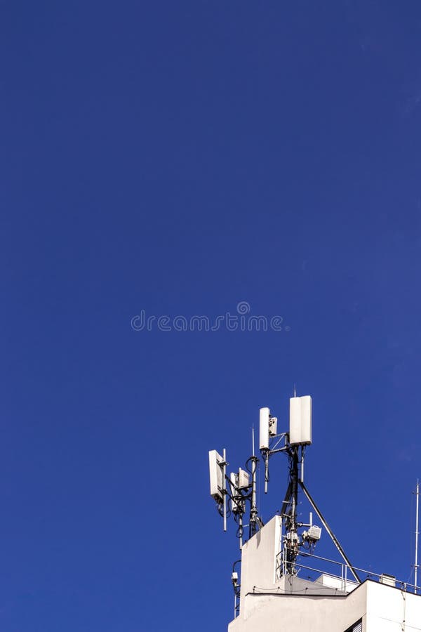 Telecommunication Tower with Copy Space in Roof Top of Building.Digital ...