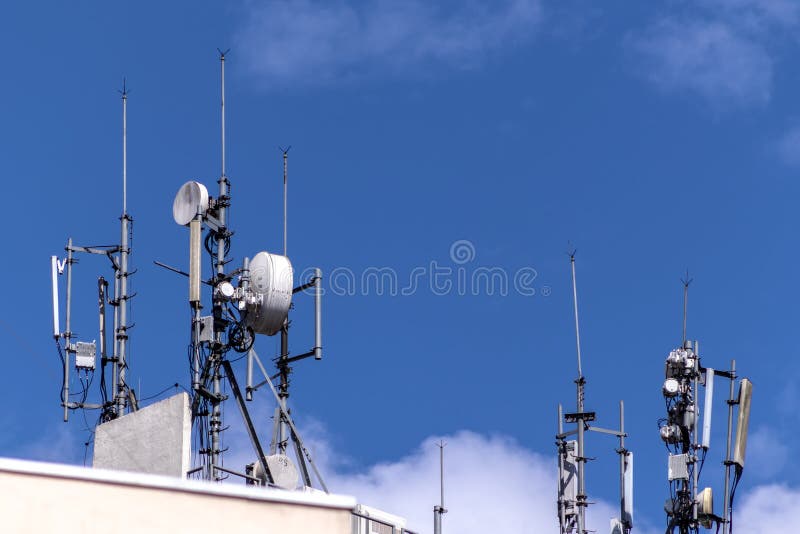 Telecommunication Tower with Copy Space in Roof Top of Building.Digital ...