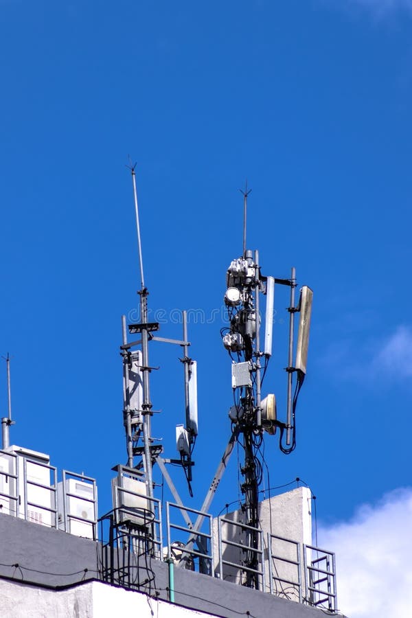 Telecommunication Tower with Copy Space in Roof Top of Building.Digital ...
