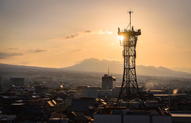 Telecommunication Tower with 5G Cellular Network in the City at Sunrise ...
