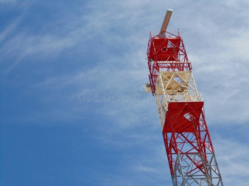 Telecommunication Tower Reaching for the Blue Sky with Light Clouds ...
