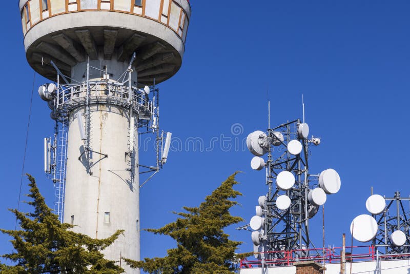 Telecommunication Tower and Water Tank Rising into Blue Sky Stock Photo ...