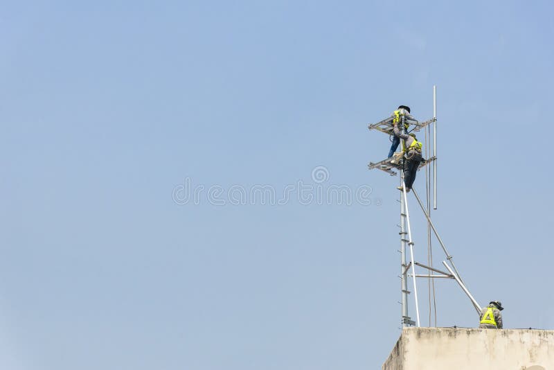 The Telecommunication Tower with the Worker Stock Photo - Image of ...