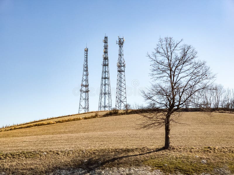 Telecommunication Towers on Field. Wireless Communication Antenna ...