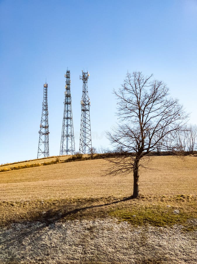 Telecommunication Towers on Field. Wireless Communication Antenna ...