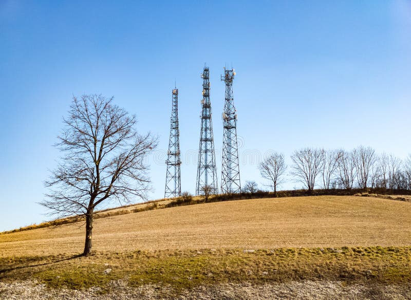 Telecommunication Towers on Field. Wireless Communication Antenna ...