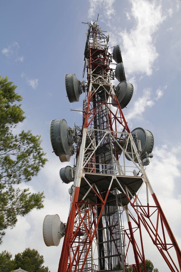 Telecommunications Tower Against Blue Sky Stock Photo - Image of signal ...