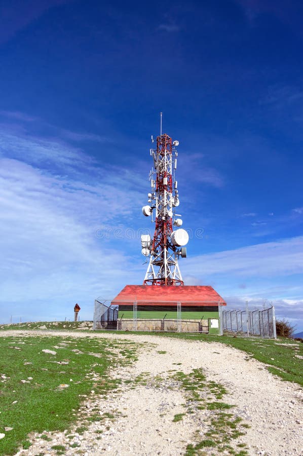 Telecommunications Tower Building Against Blue Sky Stock Image - Image ...