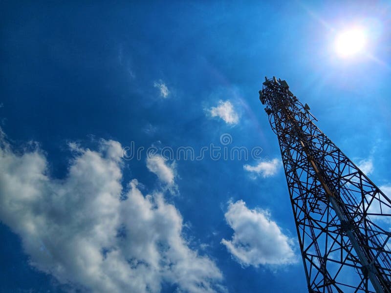 Telecommunications Tower with Cloudly Skies Stock Photo - Image of ...
